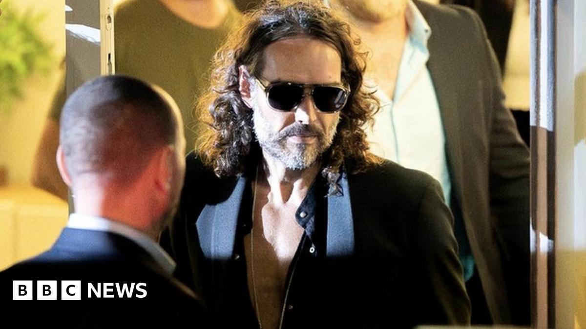 Russell Brand shows postponed as police look into 2003 claim - BBC News