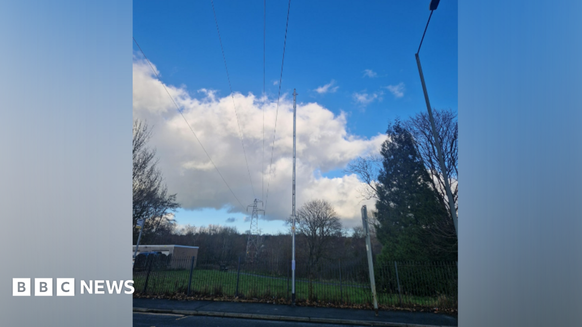 Metal mast put up a few feet from live power line - BBC News
