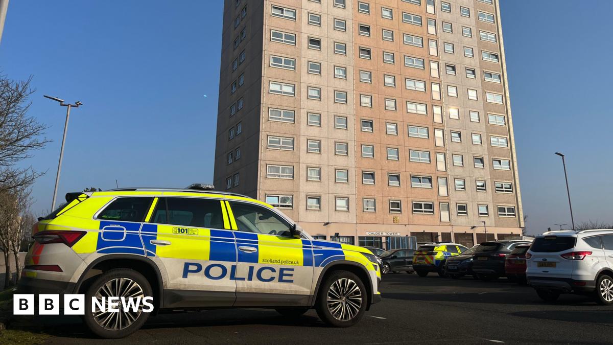 Two charged in tower block firearms incident - BBC News
