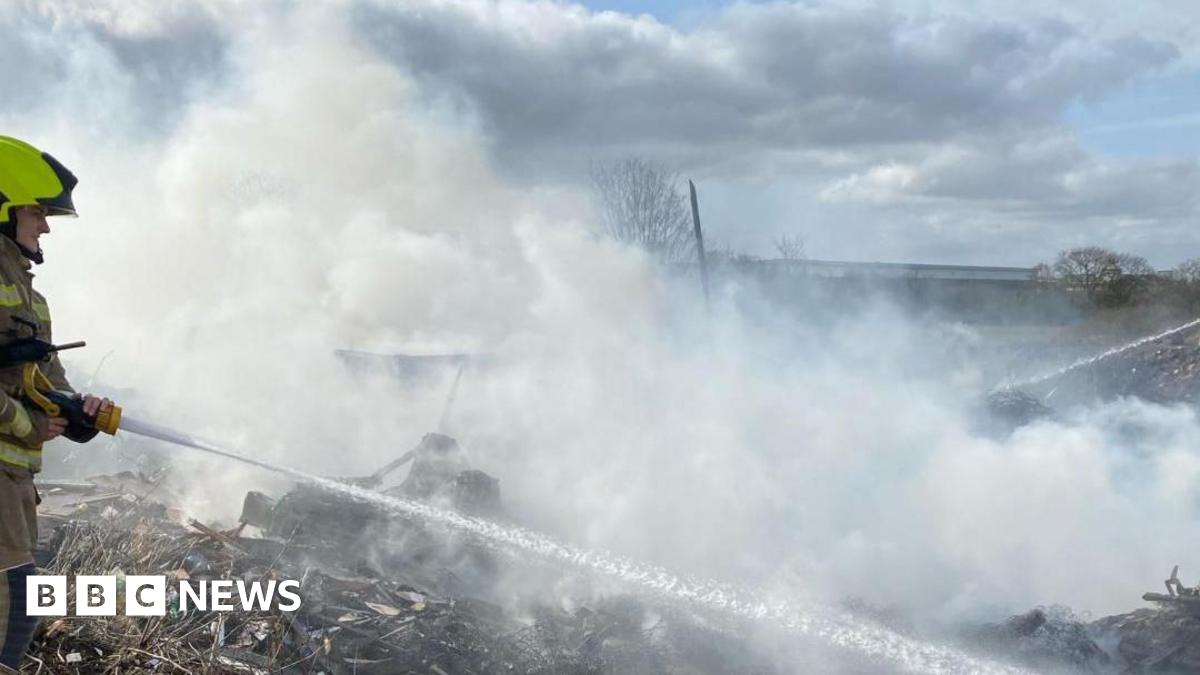 Crews tackle waste and tyres fire at yard near Basildon and A127 - BBC News