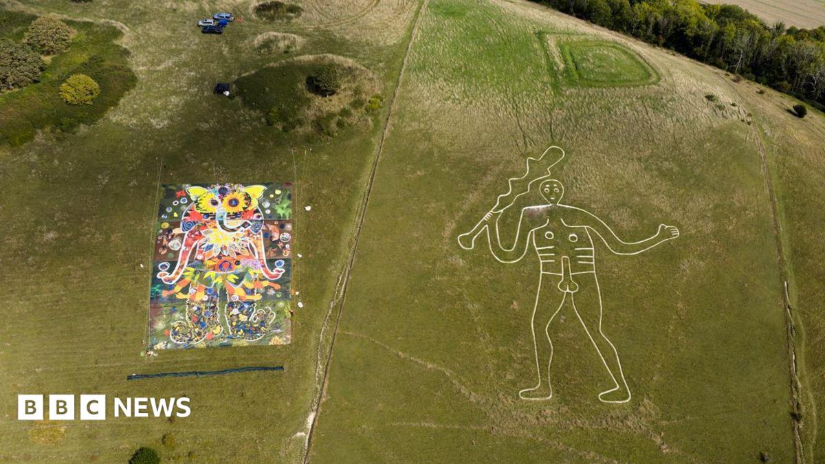 Iconic Cerne Abbas Giant gets hillside companion - BBC News