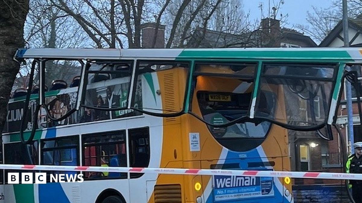 Manchester: Double-decker bus roof loses roof in tree crash - BBC News
