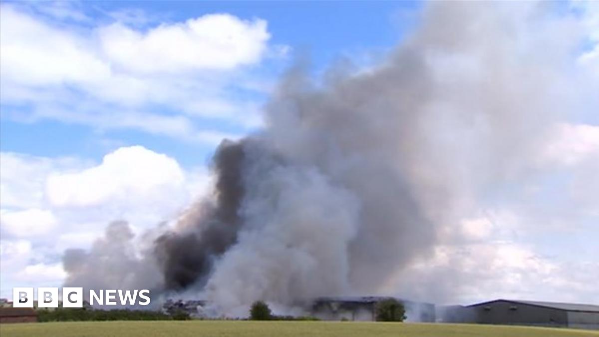 Staff help fire crews with Ancaster recycling fire clean-up - BBC News
