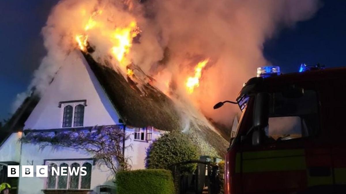 Crews tackle thatched Hengrave building fire - BBC News