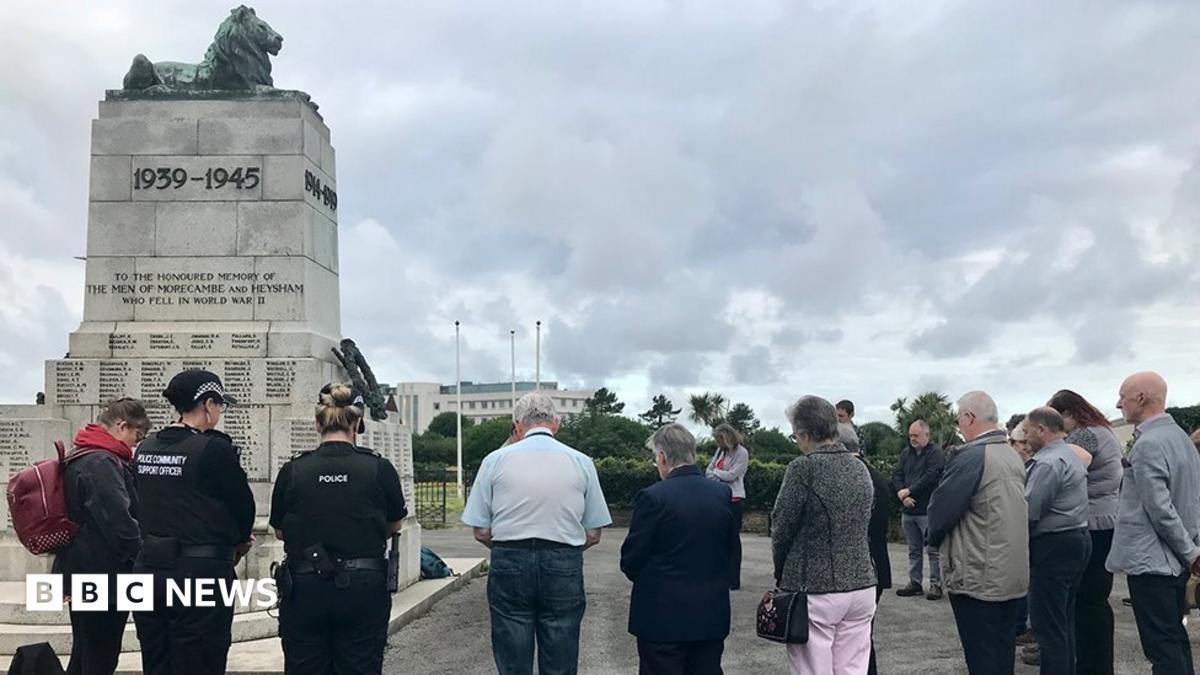 Morecambe protest after graffiti attack on war memorial - BBC News