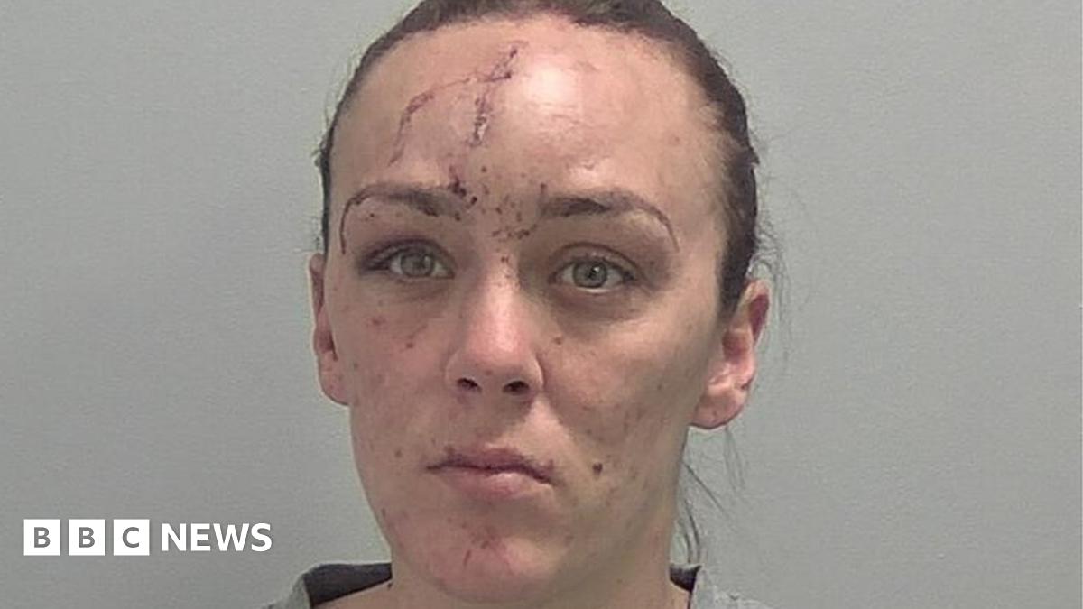 Carly Lane jailed for spitting blood on police officers - BBC News