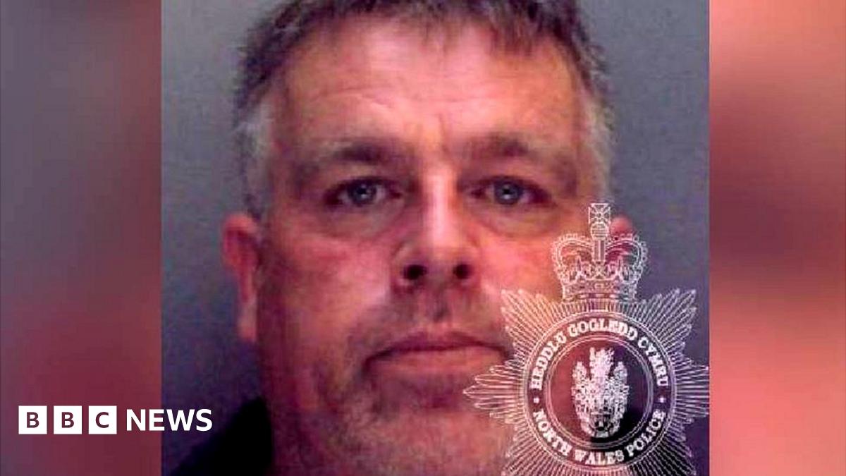 Anglesey crossbow murder victim scammer jailed six years - BBC News