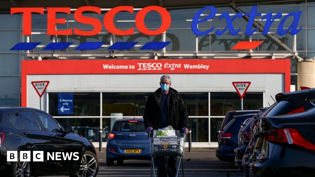 Tesco counts cost of Covid trading as profits drop - BBC News