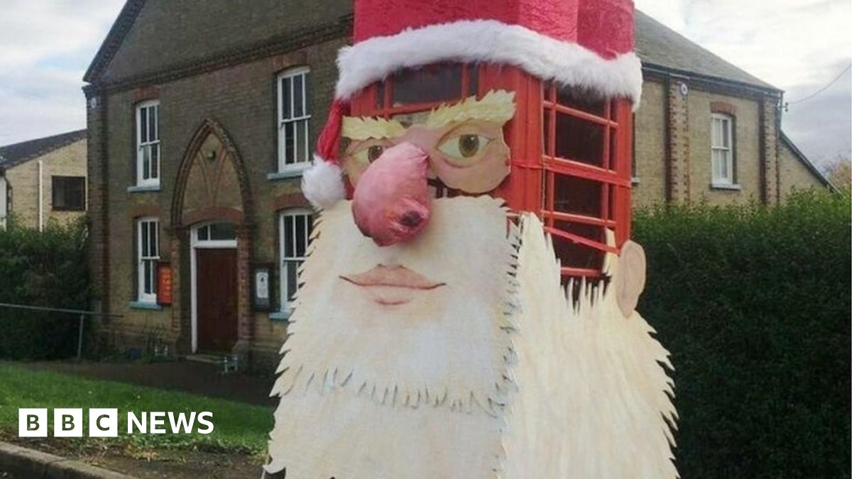 Phone box gets festive Santa makeover in Prickwillow - BBC News