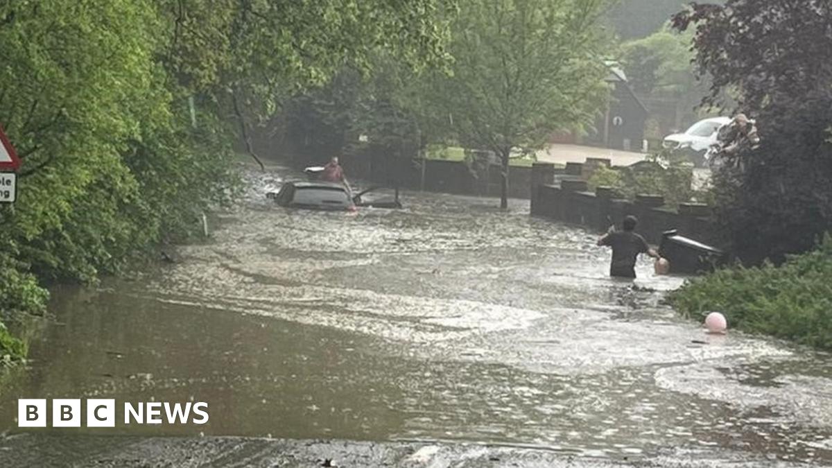 Flood water cascades down streets in Hertfordshire after thunderstorms ...