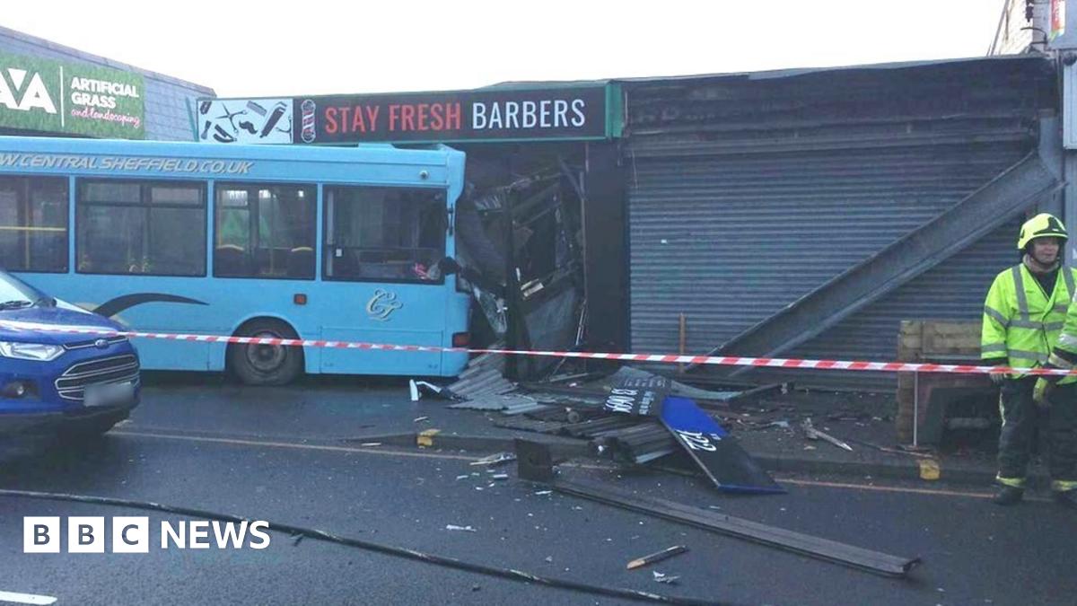 Sheffield school bus crashes into barbers shop - BBC News