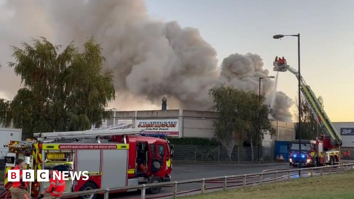 Crews tackle large blaze at Altrincham commercial premises - BBC News