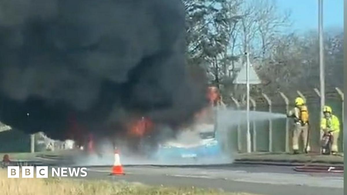 Bus engulfed by fire near Royal Marines base - BBC News