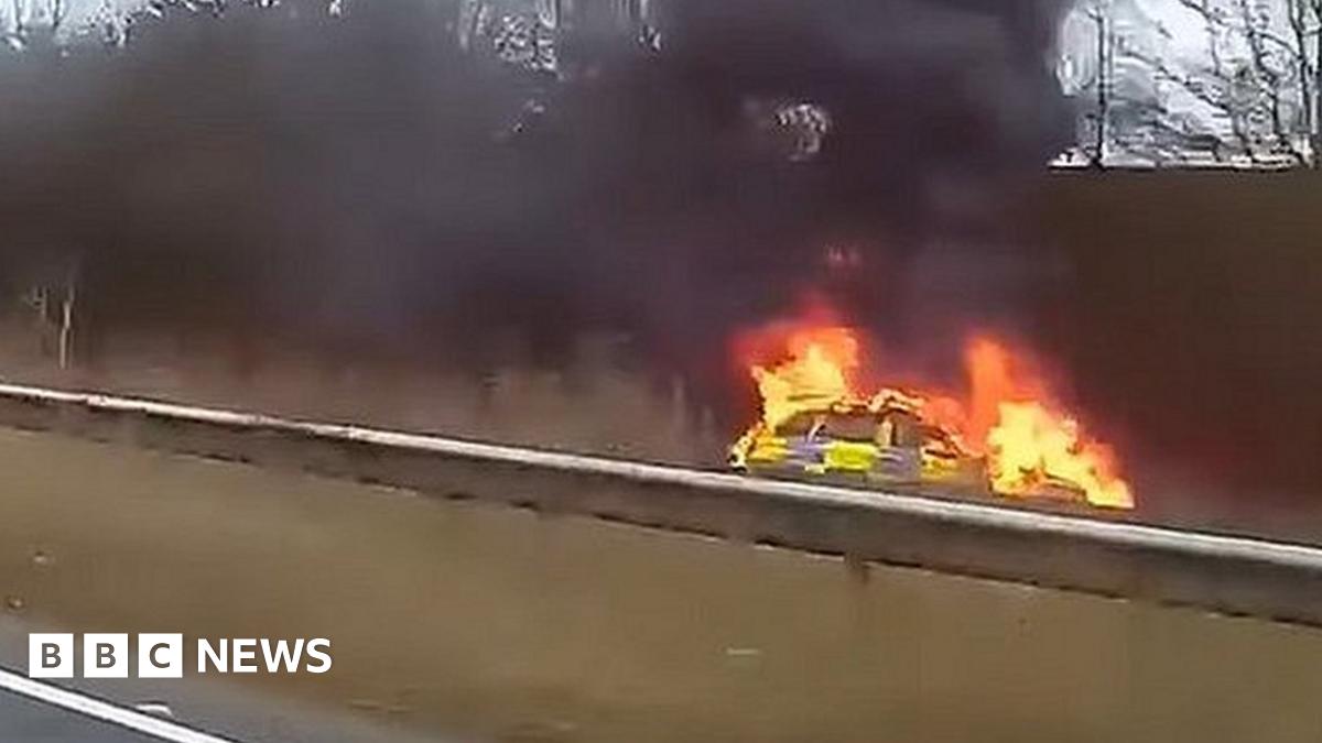 Norfolk Police car on fire caught on motorbike's dashcam - BBC News