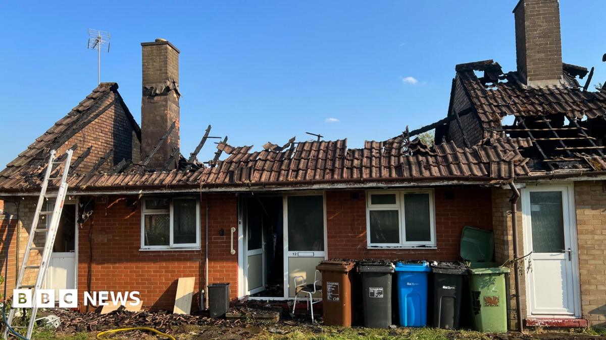 Crews battle 'devastating fire' at Corby bungalows - BBC News
