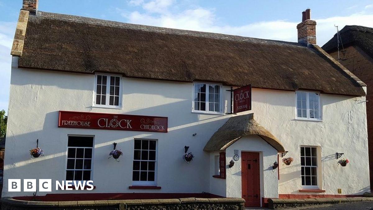 Rebuilt thatched Dorset pub shut over rising costs to reopen - BBC News
