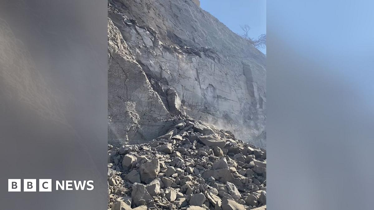 Cliff fall danger warning after 'huge' collapse at Seatown - BBC News