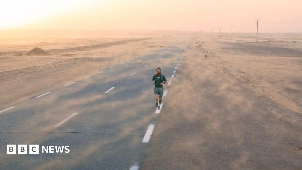 Soft Play: Finish line gig for man running length of Africa - BBC News