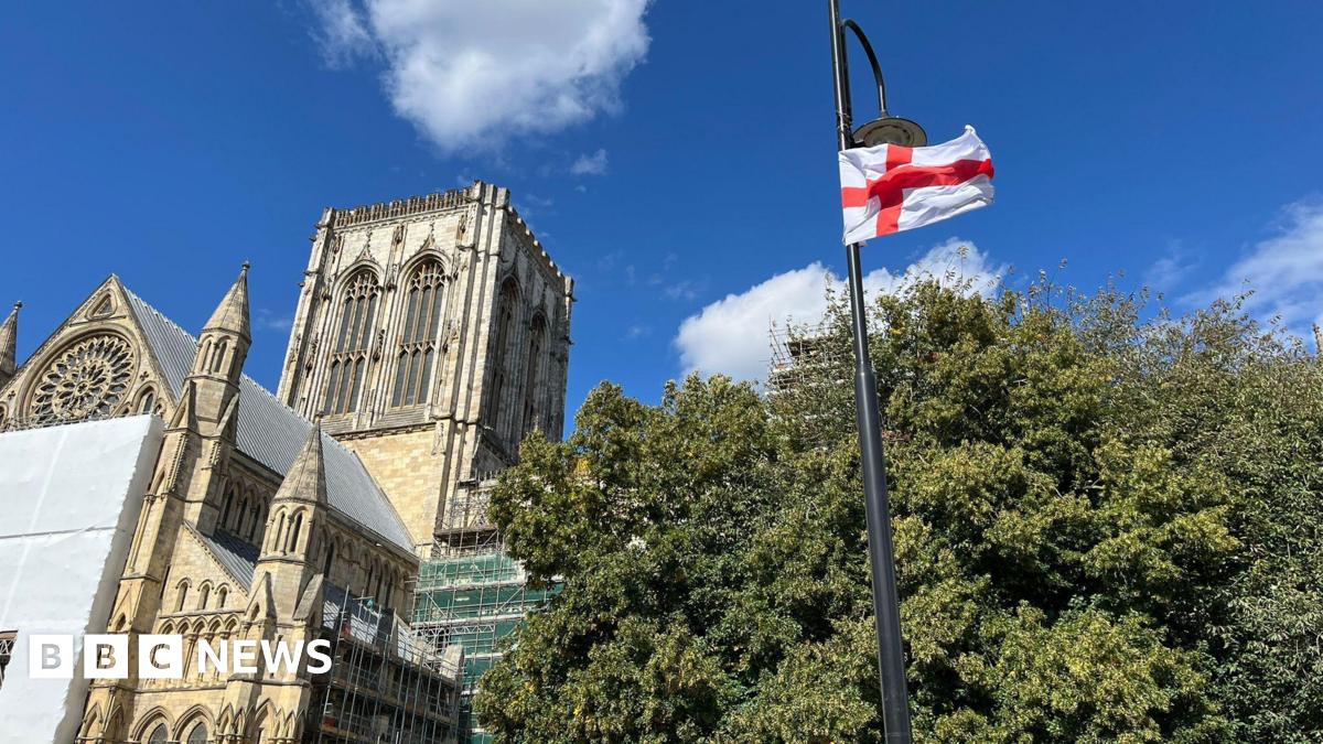Workers hired to remove flags 'threatened' in York, MP claims - BBC News