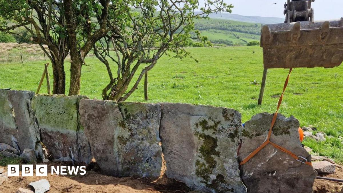 Rare slate fences restored in Lake District areas - BBC News