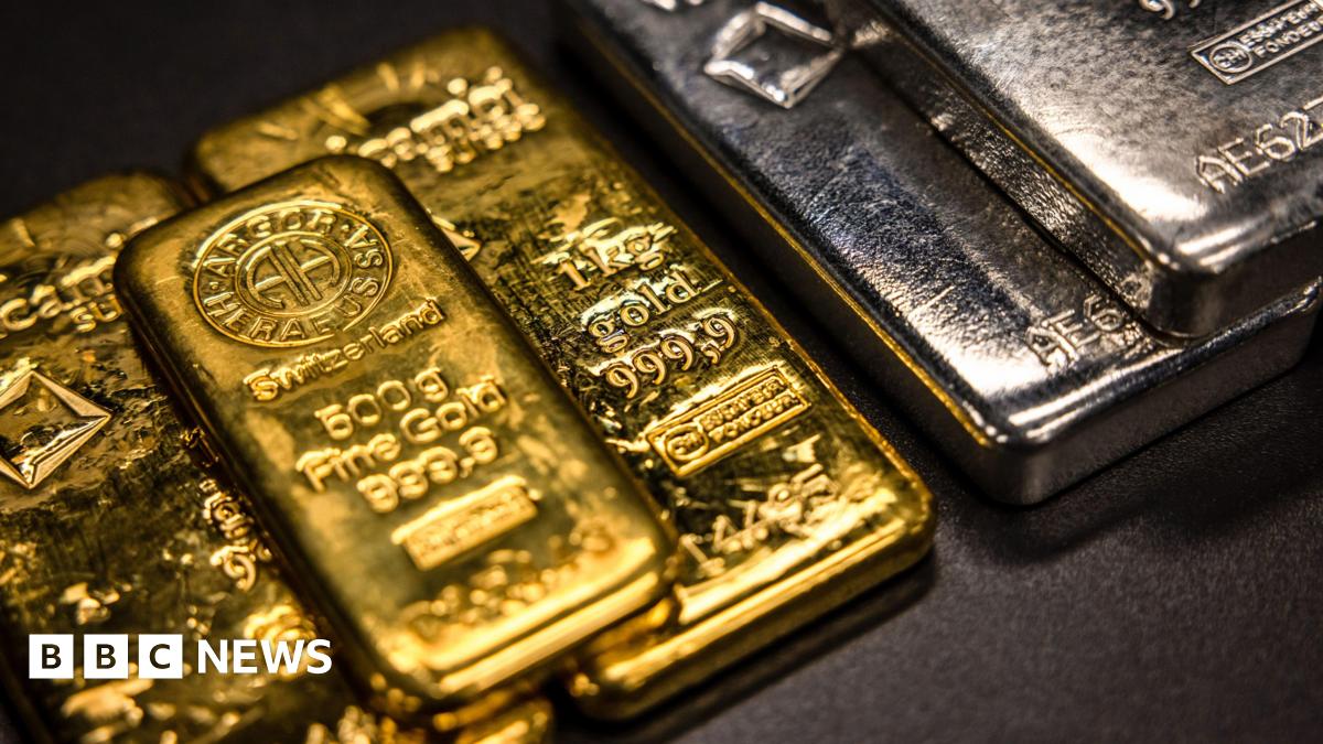 Gold and silver resume slide after Friday's plunge - BBC News