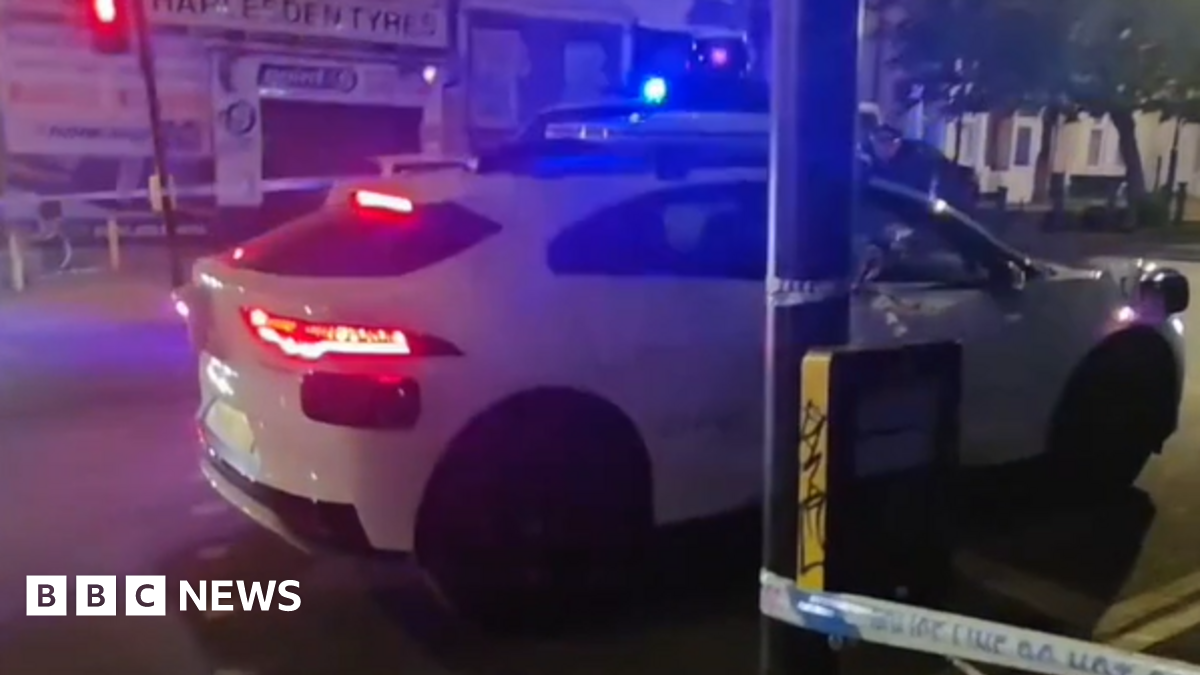 Waymo taxi: Watch car veer into Harlesden crime scene - BBC News