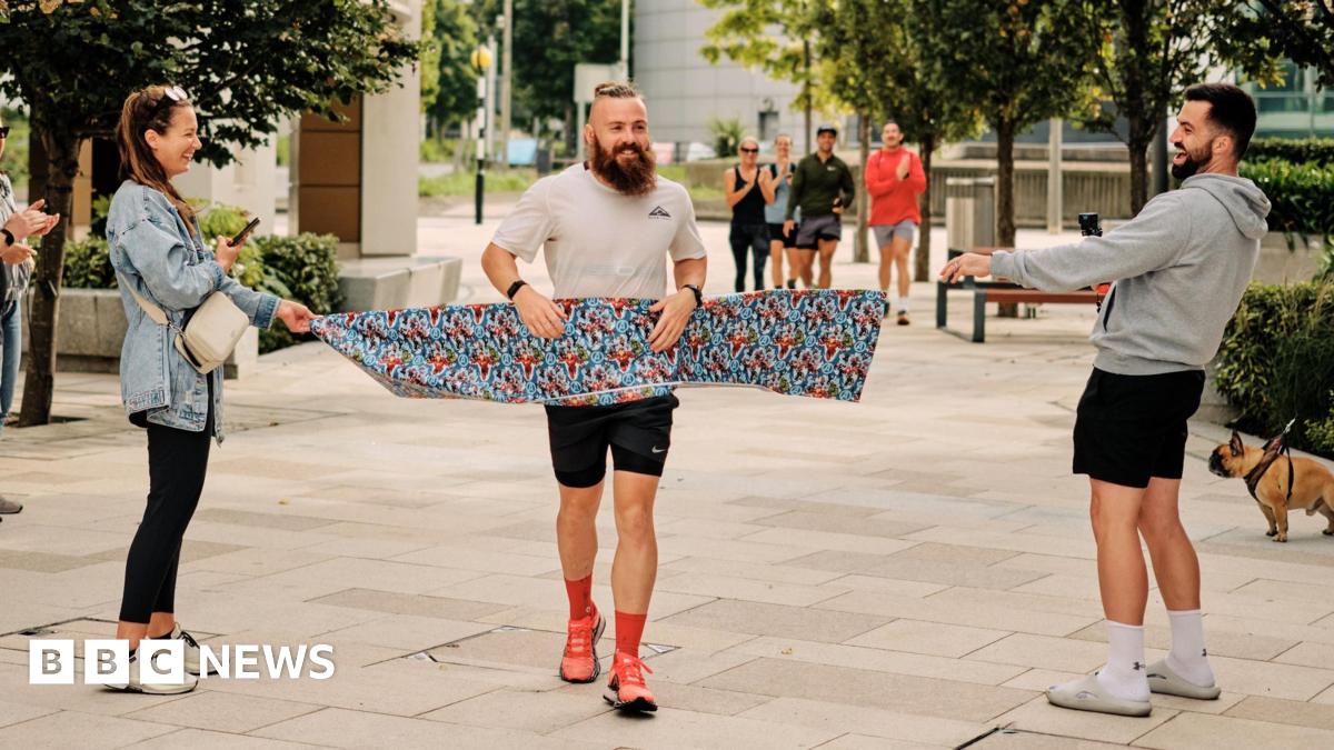 Man completes double Ironman challenge in Jersey - BBC News