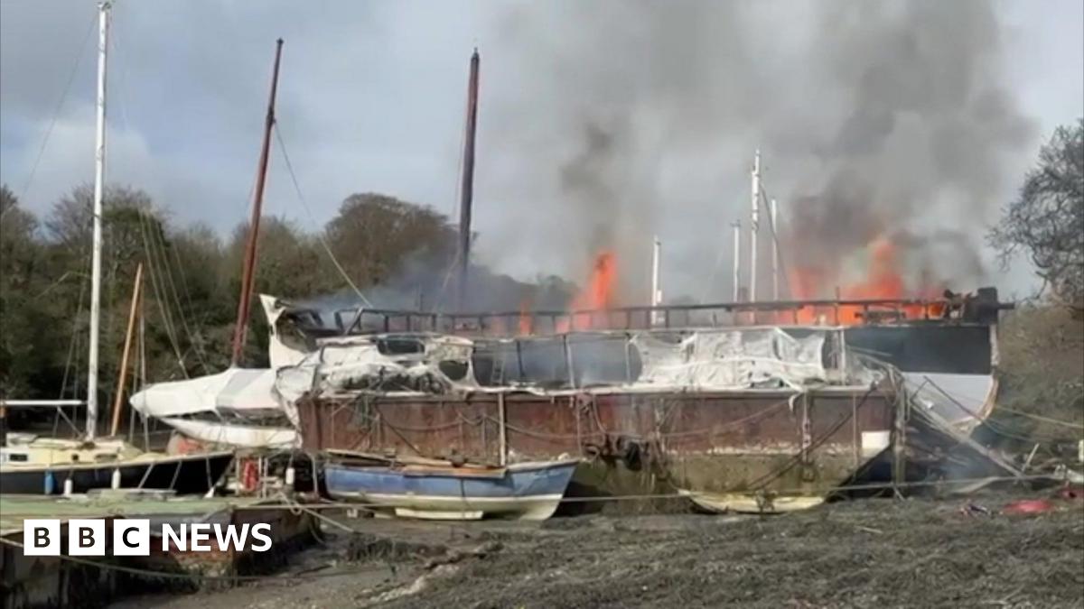 Casualty taken to hospital after boat blaze in Cornwall estuary - BBC News
