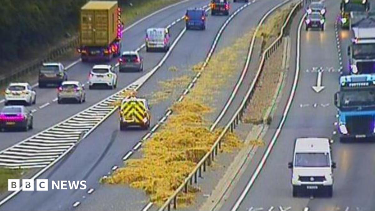 Hay bales block A14 westbound at rush hour after accident - BBC News