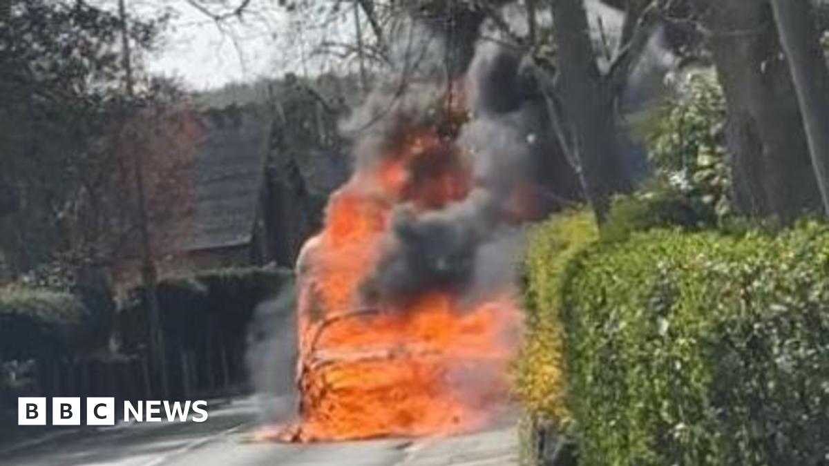 Busy Staffordshire road closed after car and caravan catch fire - BBC News
