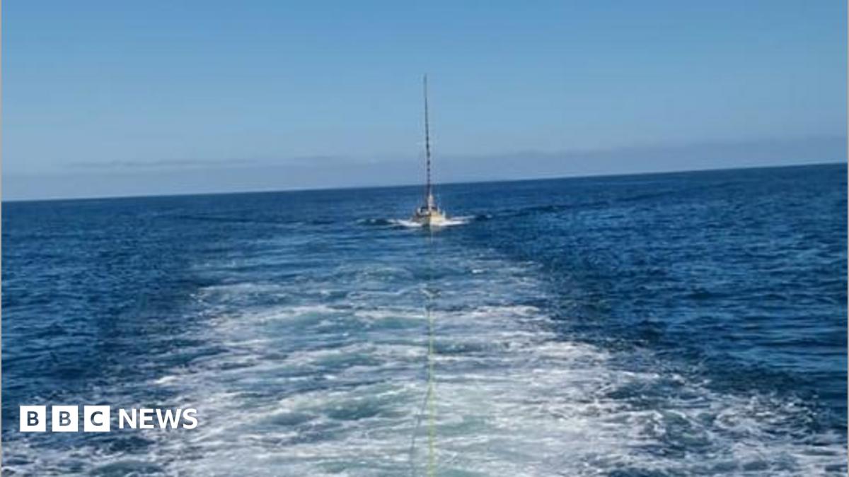 Yacht towed back to shore after losing power off Jersey - BBC News