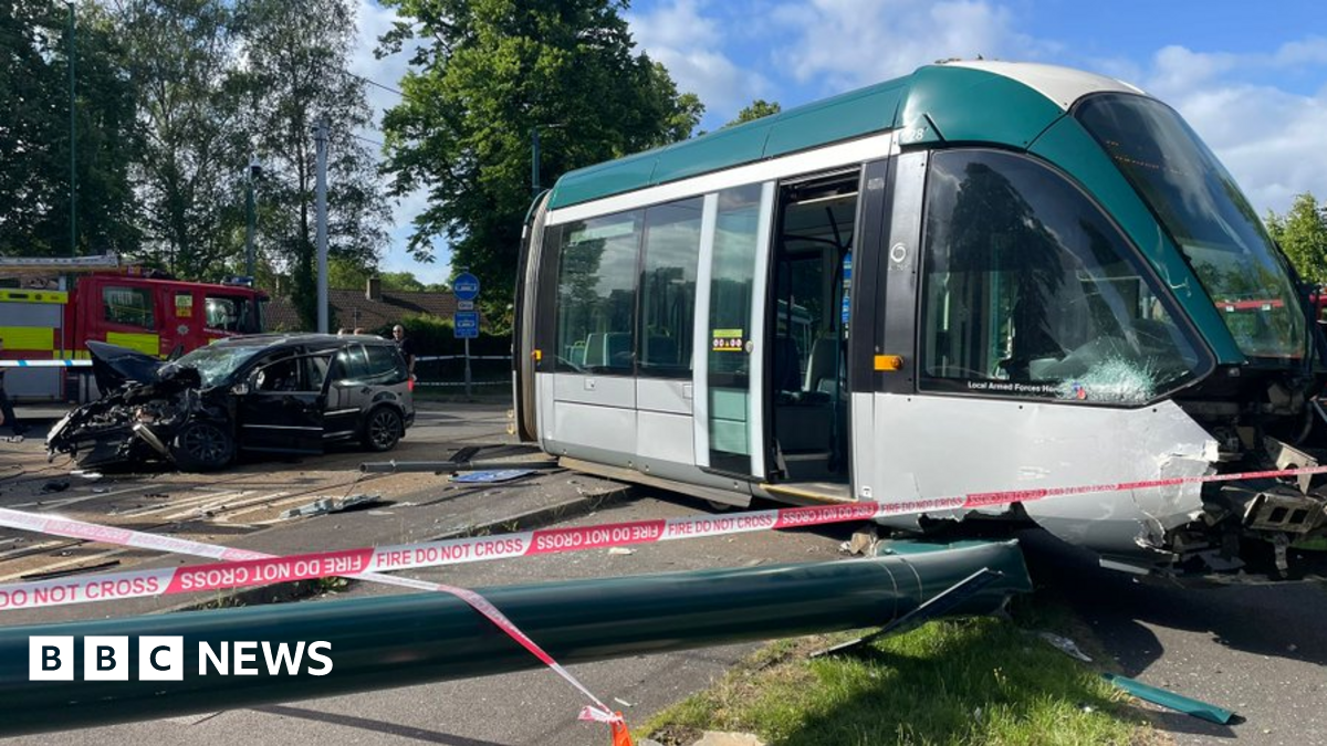 Nottingham tram derails after being hit by car - BBC News