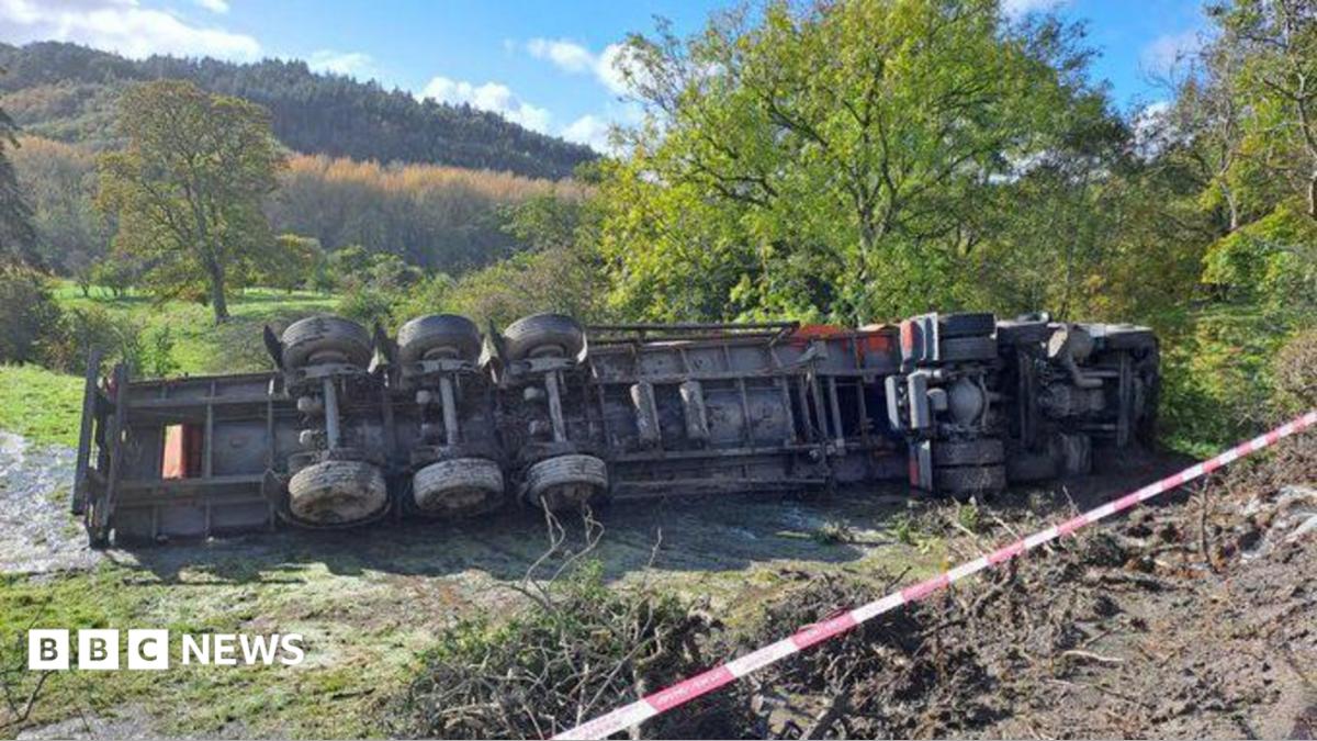 Lorry overturns on A488 near More after heavy rain - BBC News