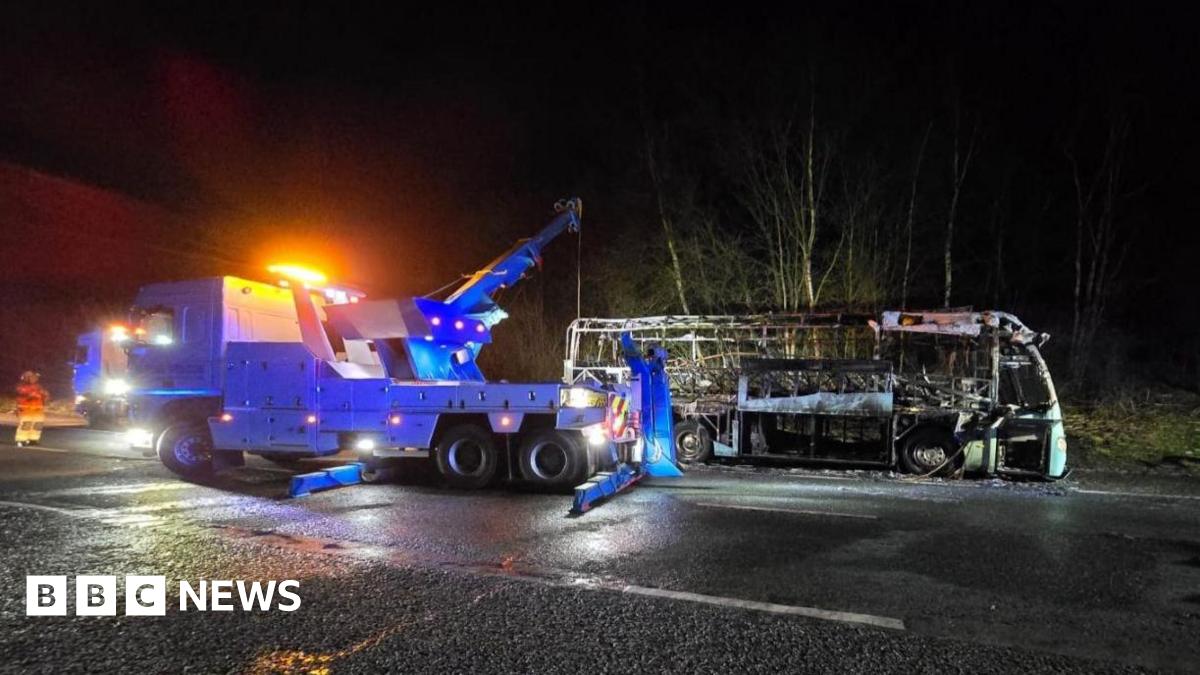 Fire rips through coach carrying schoolchildren on M60 slip road - BBC News