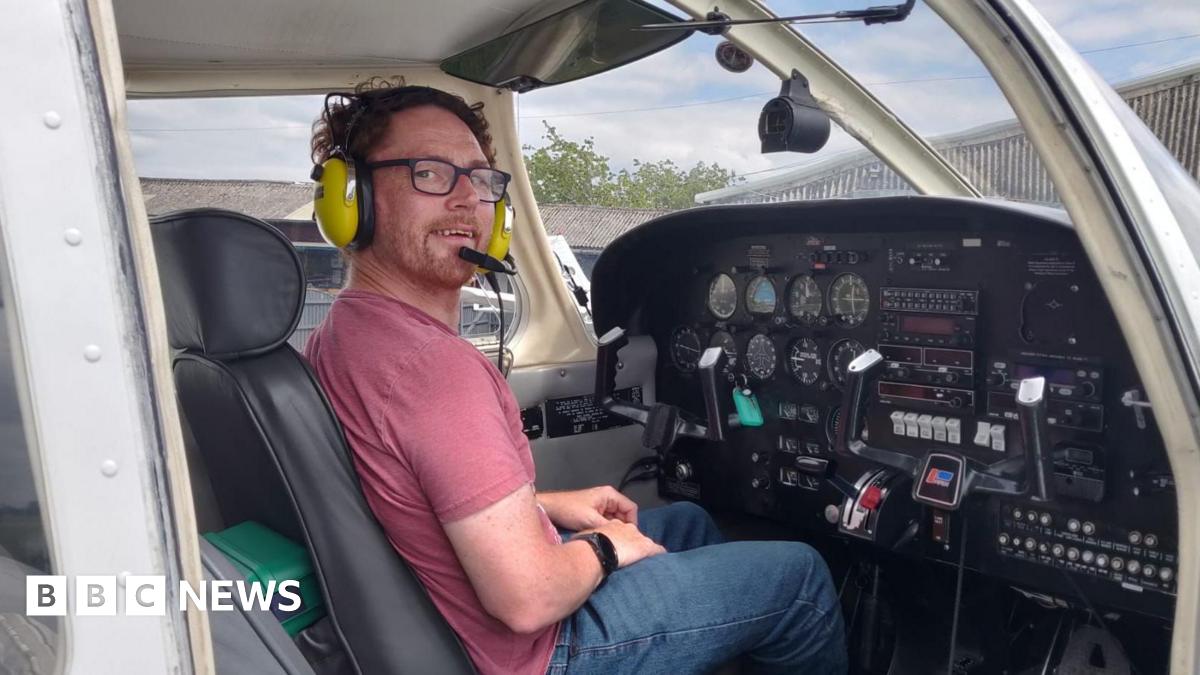 Disabled flier's salute to Spitfire crash pilot Mark Long - BBC News