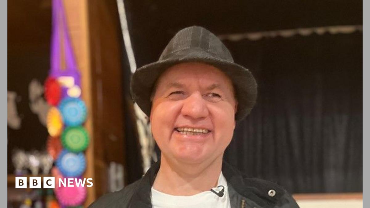 Blind dancer from Manchester urges others to salsa and jive - BBC News