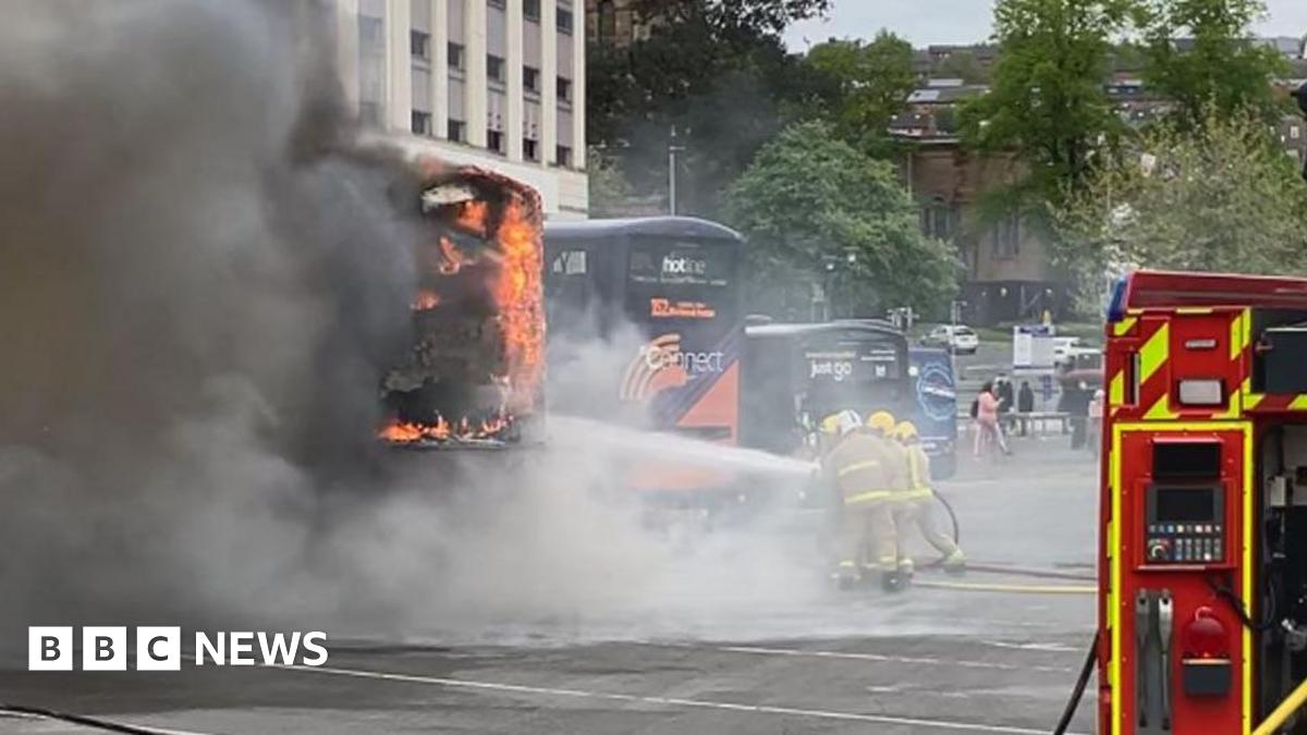 Blackburn fire crews tackle double decker bus blaze - BBC News