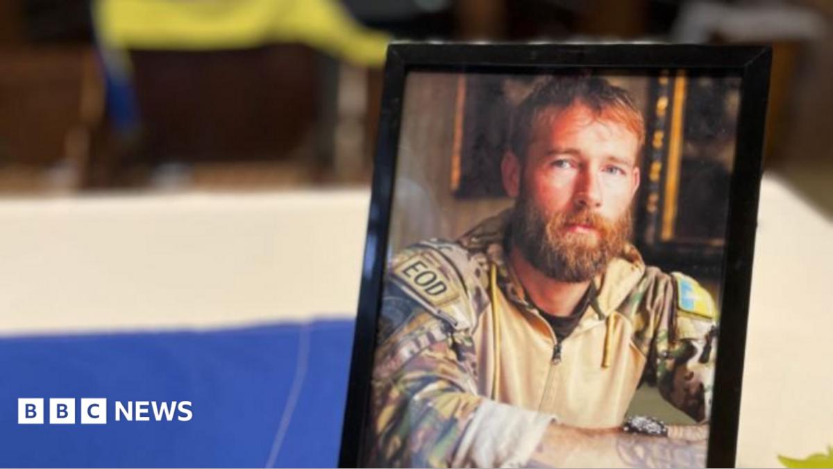 Chris Garrett: Memorial for bomb specialist killed in Ukraine - BBC News