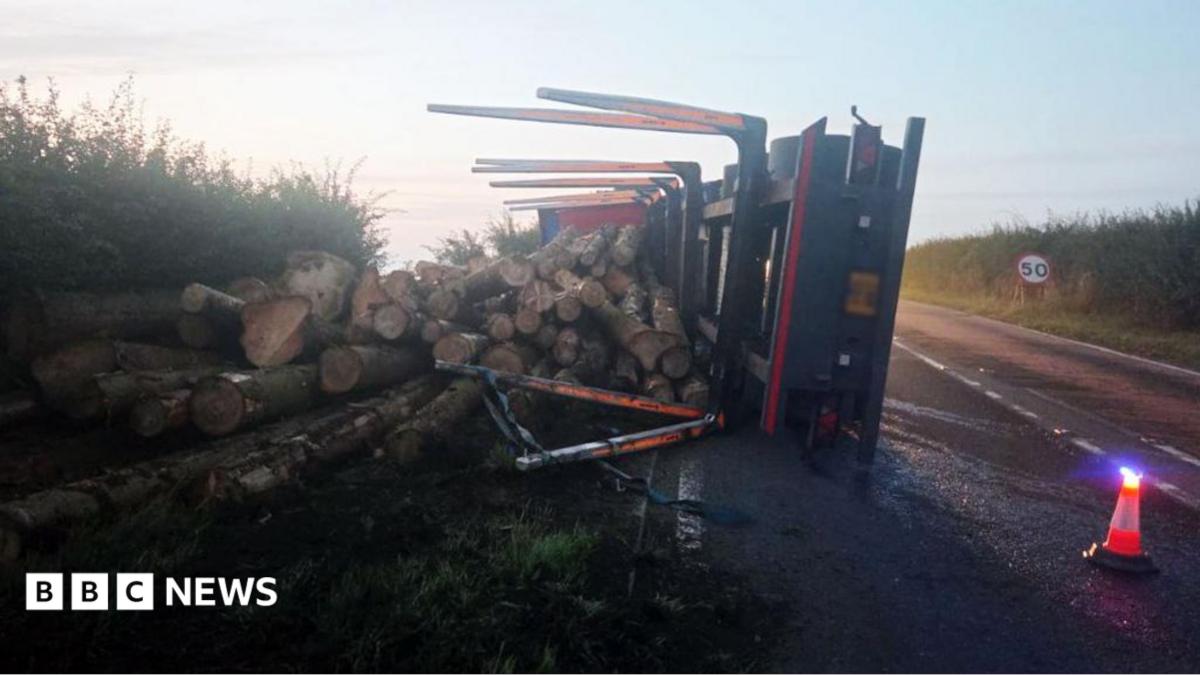 A617 closed after logs spill out in lorry crash - BBC News