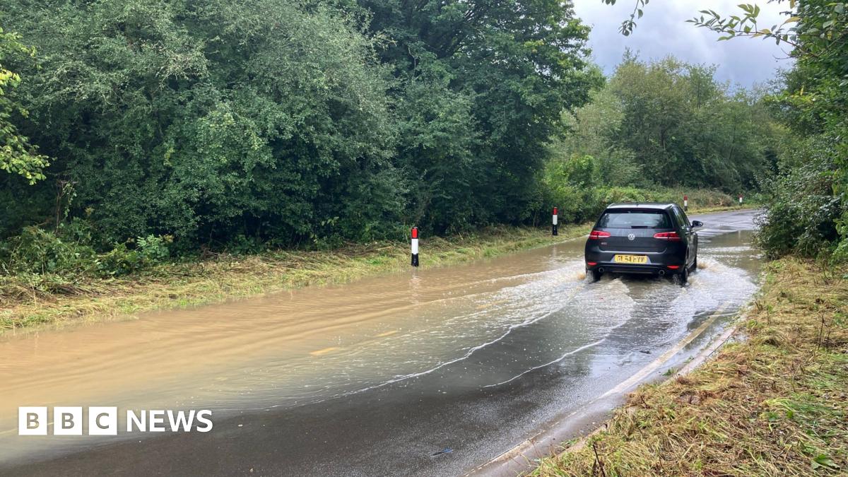 Flooding causes rail and road disruption after heavy rain - BBC News