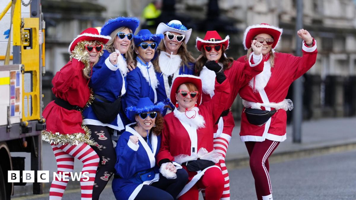 Liverpool's Santa Dash: 8,000 runners join event with Sinfield - BBC News