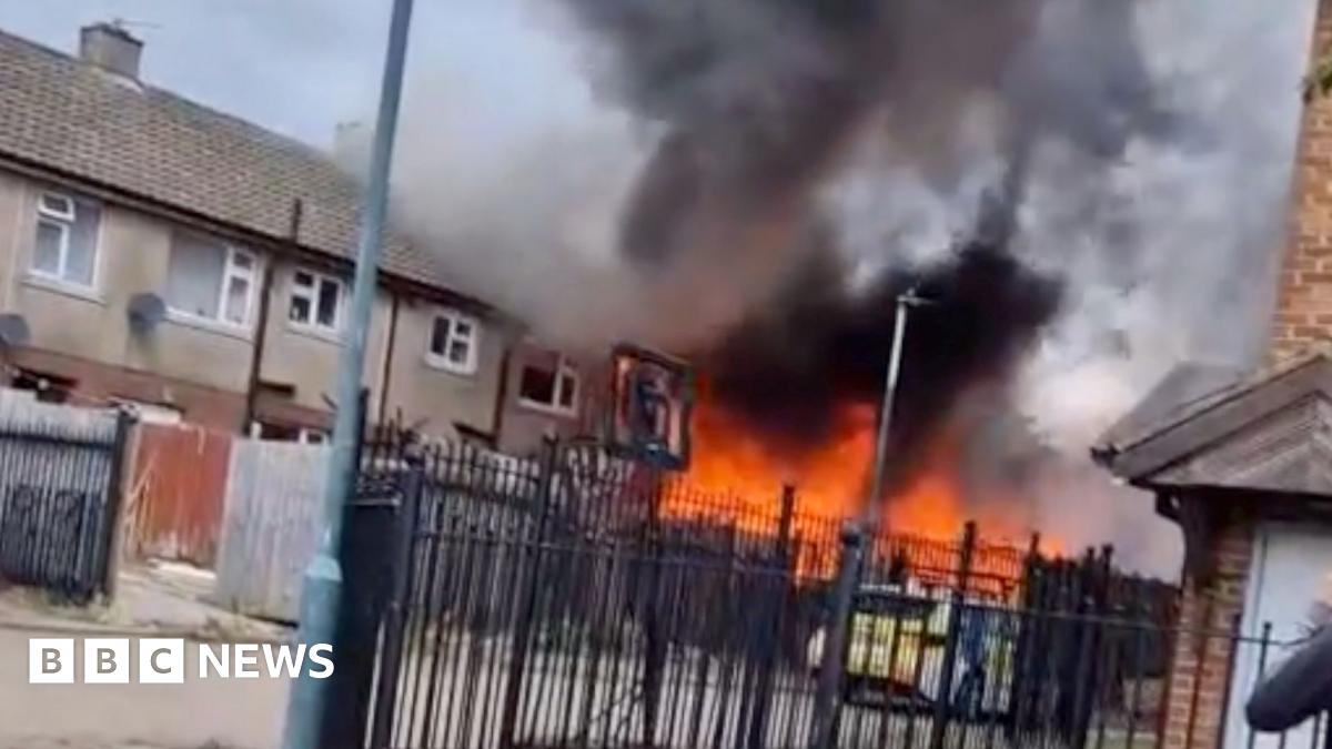 Fire crews tackle Bradford house blaze that started in shed - BBC News