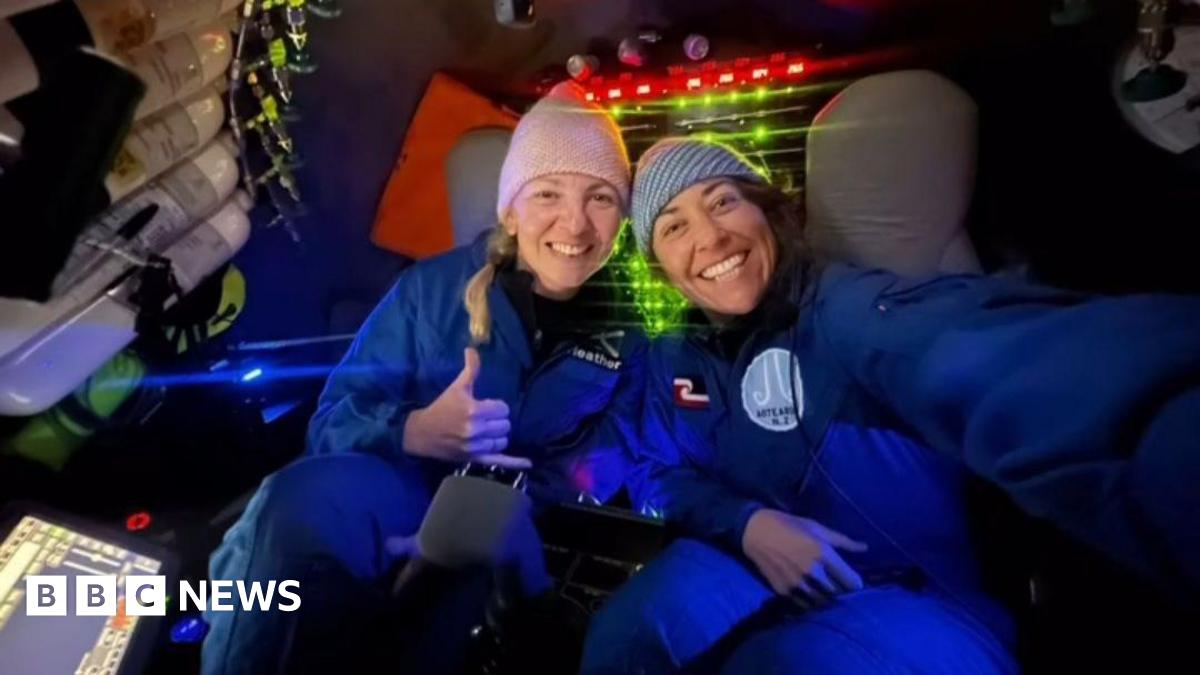 Woman breaks world record in deepest dive by all-female-crew - BBC News
