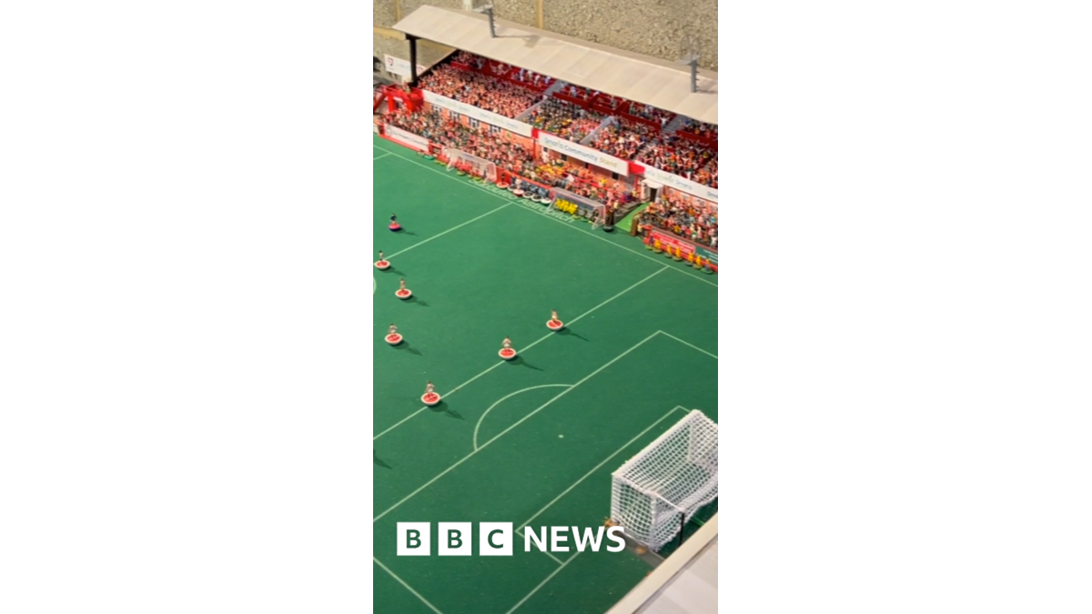 Man builds replica Cheltenham Town stadium for Subbuteo pitch - BBC News