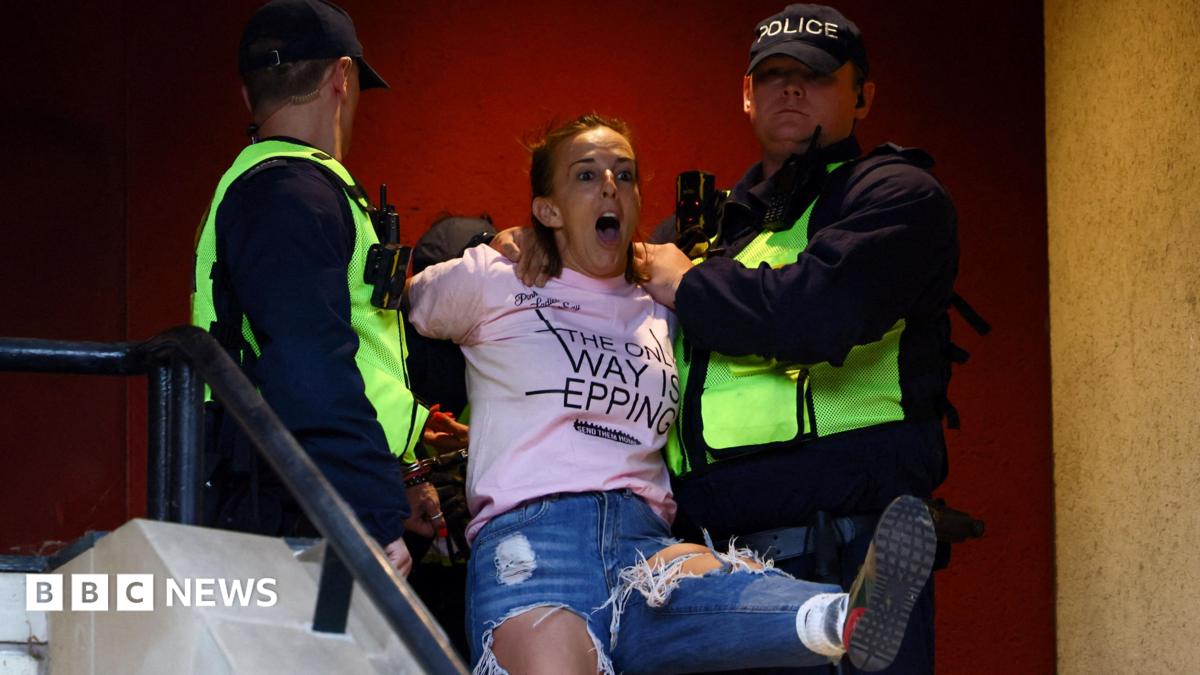 Woman charged following protest over asylum hotel in Epping - BBC News
