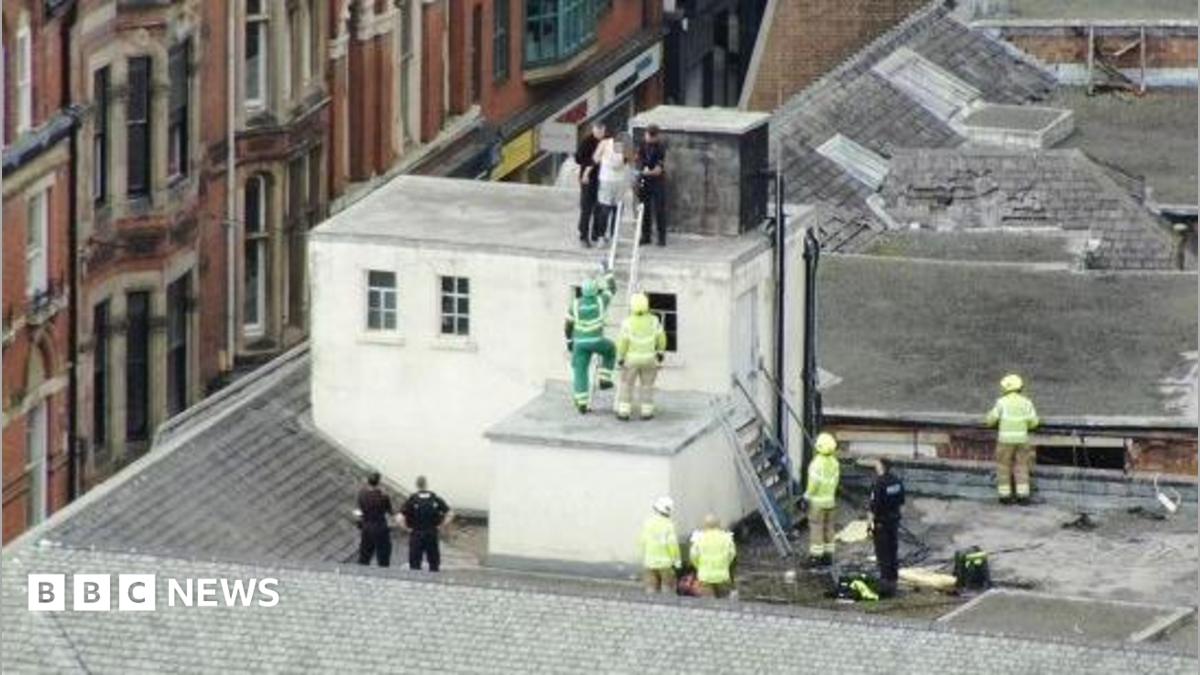 Youths bailed after tiles thrown from old Debenhams store roof - BBC News