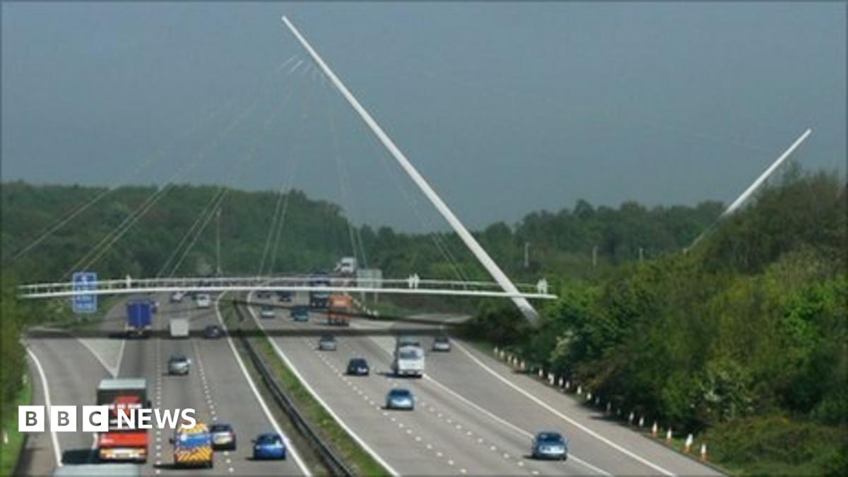 Ashford M20 suspension bridge installed - BBC News