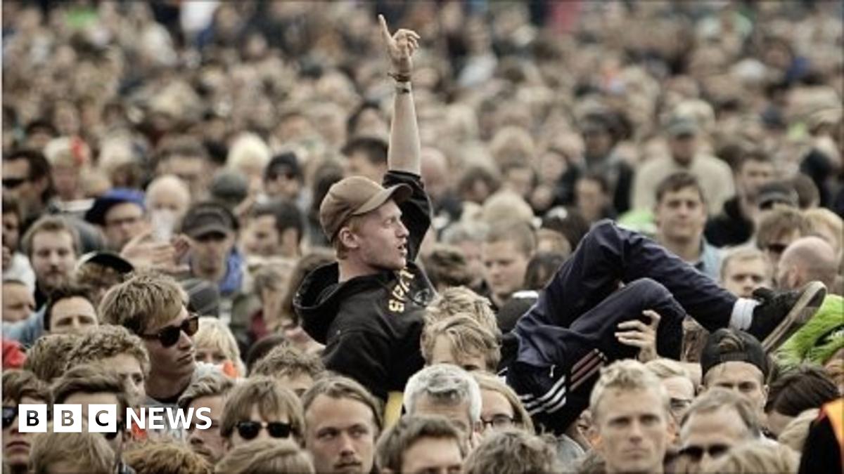 Festival-goer dies in fall at Roskilde event - BBC News