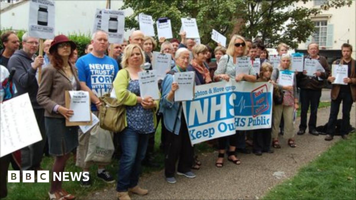 Brighton protest over controversial NHS health reforms - BBC News