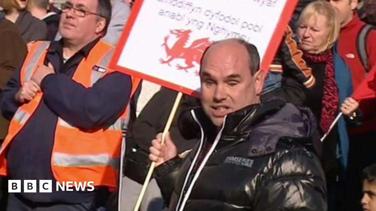 Hundreds join disability cuts protest in Cardiff - BBC News